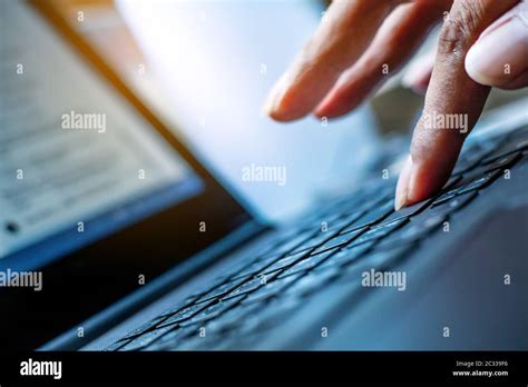 Technology And Connecting Concept Hand Human With Keyboard On Notebook Computer Blurred