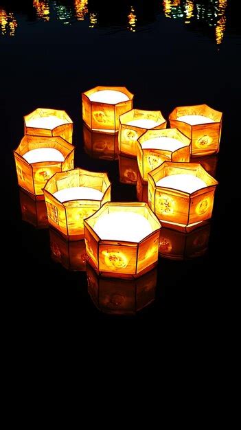 Floating Lanterns On Water At Night Premium Ai Generated Image