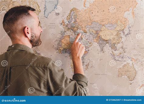 Rear View Of Man Pointing Vintage Map With His Finger Stock Image Image Of Adult Summer