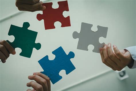 Successful Business Team Collaborates To Solve Challenges Symbolized By