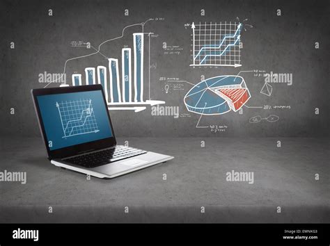 Laptop Computer With Graph On Screen Stock Photo Alamy
