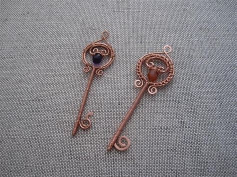 Wire Wrap Key Pendant With Blue Stone