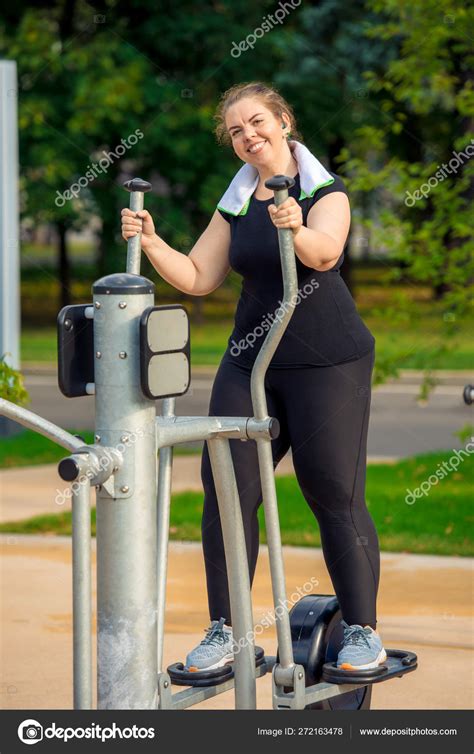 Active Fat Woman Without Complexes Is Engaged On The Stepper Sim Stock Photo Kosmos