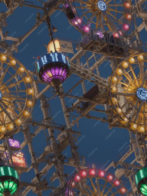 Premium Ai Image A Futuristic Carnival With A Neonlit Ferris Wheel And A Robotic Carousel