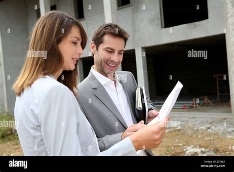 Couple On Construction Site Checking Building Progress Stock Photo Alamy