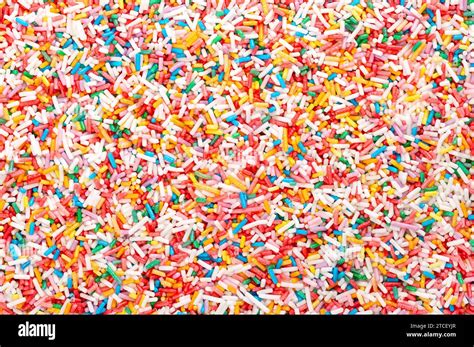 Rainbow Sprinkles Background And Surface Rod Shaped Colorful Sugar Sprinkles Tiny Candies In