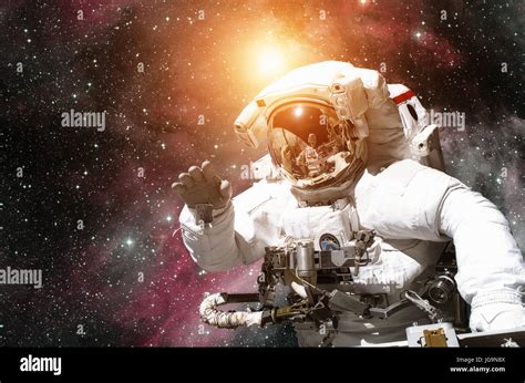 Astronaut In Outer Space Nebula On The Background Elements Of This