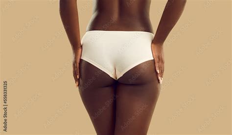 Close Up Crop Rear View Of African American Woman Buttock In Underwear