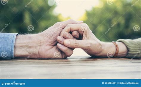 Two People Holding Hands With Compassion And Love Stock Image Image