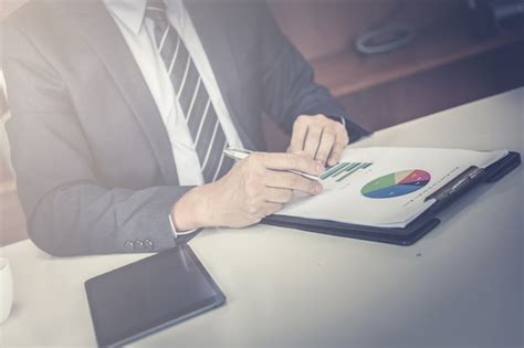 Premium Photo Businessman With Graph Analysis