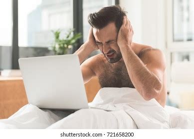 Naked Man Using Laptop Computer On The Bed Royalty Free Images Stock Photos Pictures