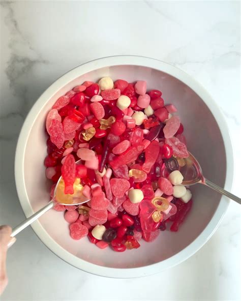 Pour Them Into A Bowl And Mix The Candy Salad With Salad Servers