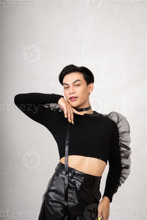 Portrait Of A Feminine Man In Black Dress And Black Hair While Wearing