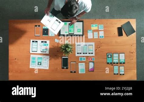 Top View Of Business Man Looking And Choosing Ux Ui Design At Meeting