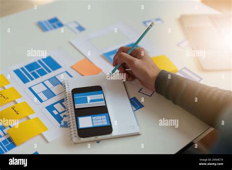 group of ux ui or designers working to create content of mobile