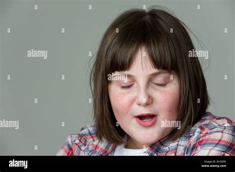 Close Up Portrait Of Young Girl With Her Eyes Closed And Shoulder