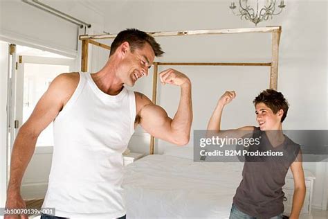 Dad Flexing Photos And Premium High Res Pictures Getty Images