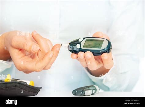 Sugar Blood Tester In Woman Hands Testing For Diabetes Stock Photo Alamy