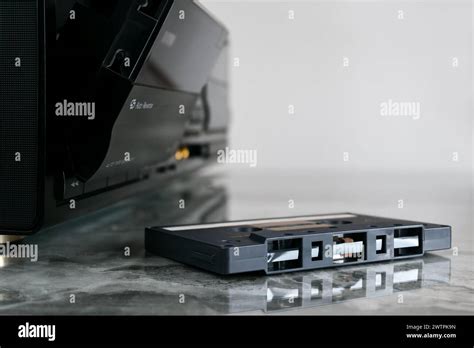 A Cassette Lies On A Polished Marble Shelf Next To An Auto Reverse Tape