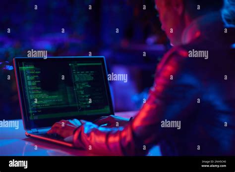 Seen From Behind Modern Woman With Laptop Decentralized Finance Coding In Modern Office Stock