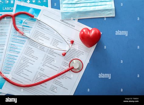 Stethoscope With Red Heart And Lists Of Laboratory Tests On Color Background Health Concept