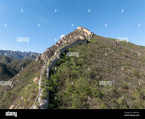A Section Of Wild Wall Surround The Preserved Great Wall Section At
