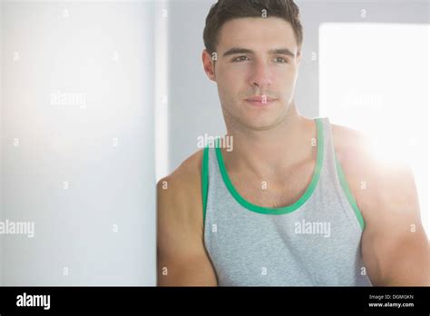 Stern Handsome Man Leaning Against Wall Stock Photo Alamy