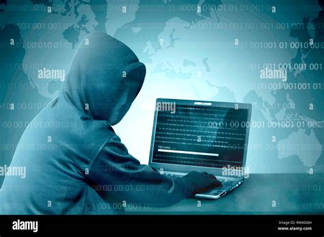 Hacker In Black Hoodie Using Laptop On The Desk To Hacking System With Binary Code And Upload