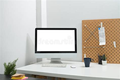 Desktop Computer With Blank Screen A Coffee Cup And Office Supplies