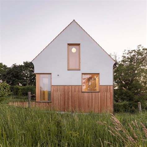 Atelier Hajný references rural Czech cabins for triangular housing block