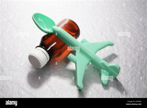 Cough Syrup And Measuring Spoon Stock Photo Alamy