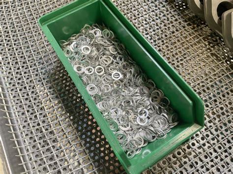 Green Box In An Assembly Station Of A Manufacturing Line Full Of Steel