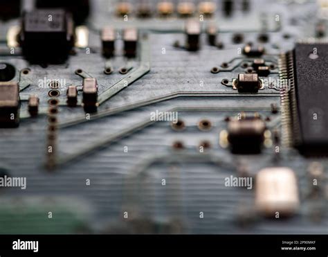 closeup of a circuit board from a hard drive with transistors and