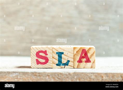 Alphabet Letter Block In Word Sla Abbreviation Of Service Level Agreement On Wood Background