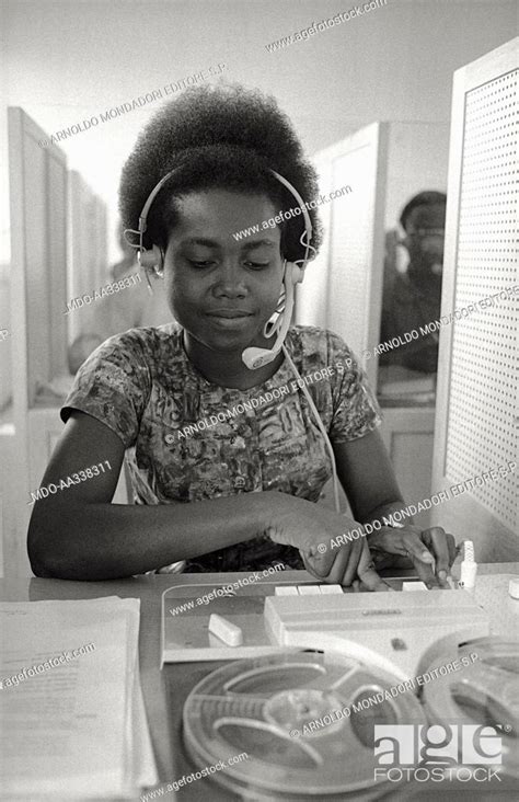 Nigerian Girl Working Nigerian Girl Working With A Tape Recorder