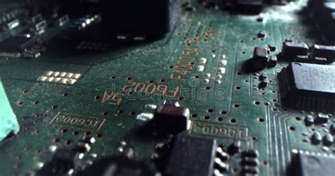 Macro Camera Moving Slowly Over Printed Circuit Board Showing Computer Motherboard Components