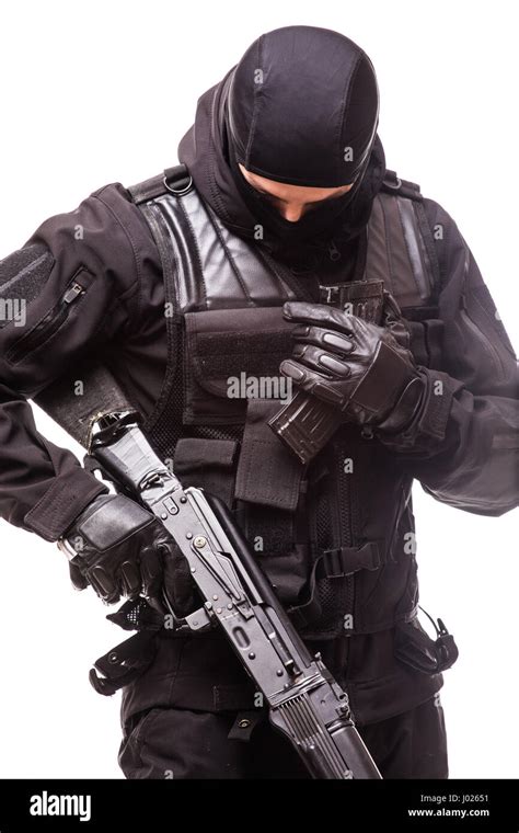 Swat Officer With Assault Rifle In Black Uniform Isolated On White