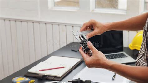 Man Work With Caliper Measure The Motor Gear Engine Part Stock Photo Image Of Caliper