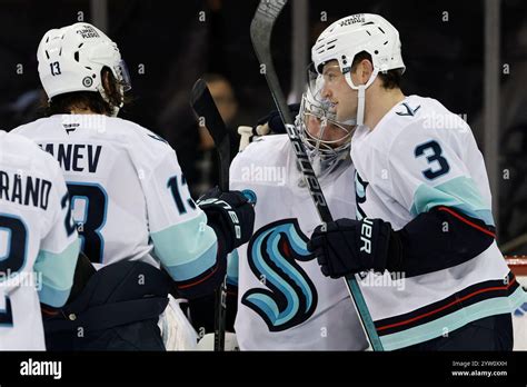 Seattle Kraken Goaltender Philipp Grubauer Center Is Congratulated By