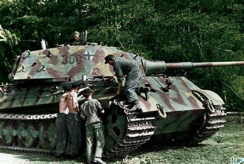 4 German Soldiers Inspecting Their Königs Tiger Somewhere In France