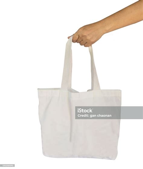 토트 백 캔버스 화이트 코튼 패브릭 천 에코 쇼핑 자루 모형 빈 템플릿 은 흰색 배경에 분리 된 여성u2019s 핸들링 핸드 토트백에 대한 스톡 사진 및 기타 이미지