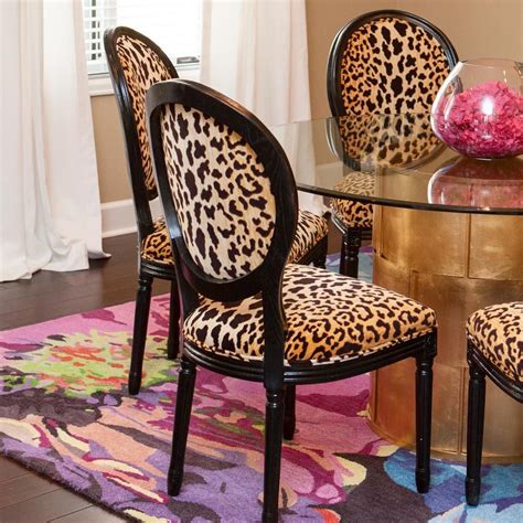 Timeless Glamour With Leopard Dining Chairs And Gold Leaf Table
