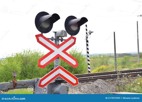 Railway Level Crossing With Semaphore And Barrier Warning Road Sign On The Proximity Of A