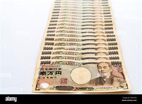 Japanese 10 000 Yen Banknotes Overlapping Each Other In A Long Line On