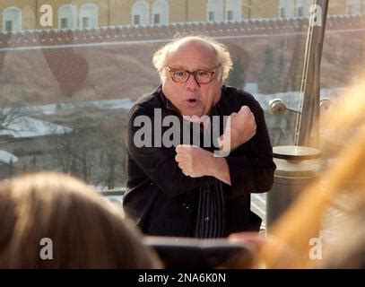Actor Danny DeVito Poses With The Lorax Figure During A Photo Session Before Premiere Of The