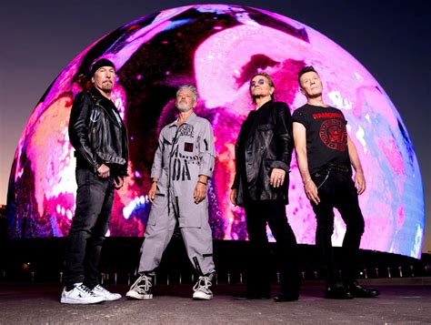 Download Rock Band Under Glowing Orb Wallpaper