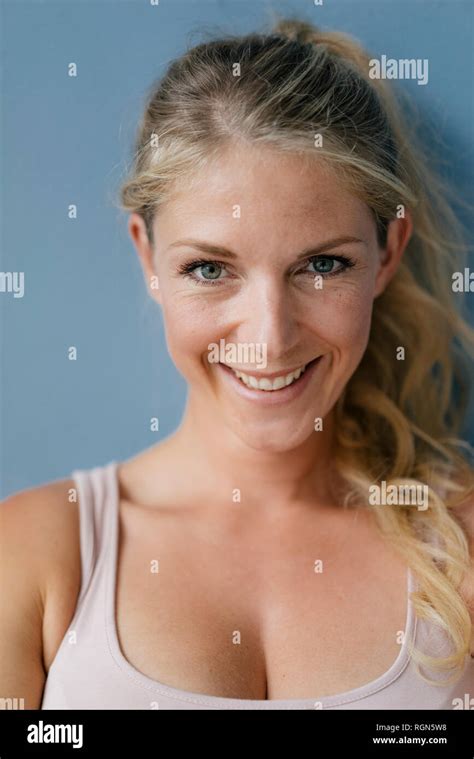 Portrait Of Smiling Blond Woman Stock Photo Alamy