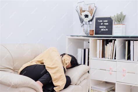 Premium Photo Young Woman Feeling Depressed Laying In Sofa Burying