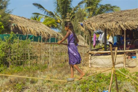 Girl Acrobat On The Beach Along The Coast Of Goa In India Editorial