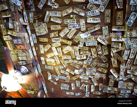 Signed One Dollar Bills Tacked On The Ceiling And Walls Of Western Bar